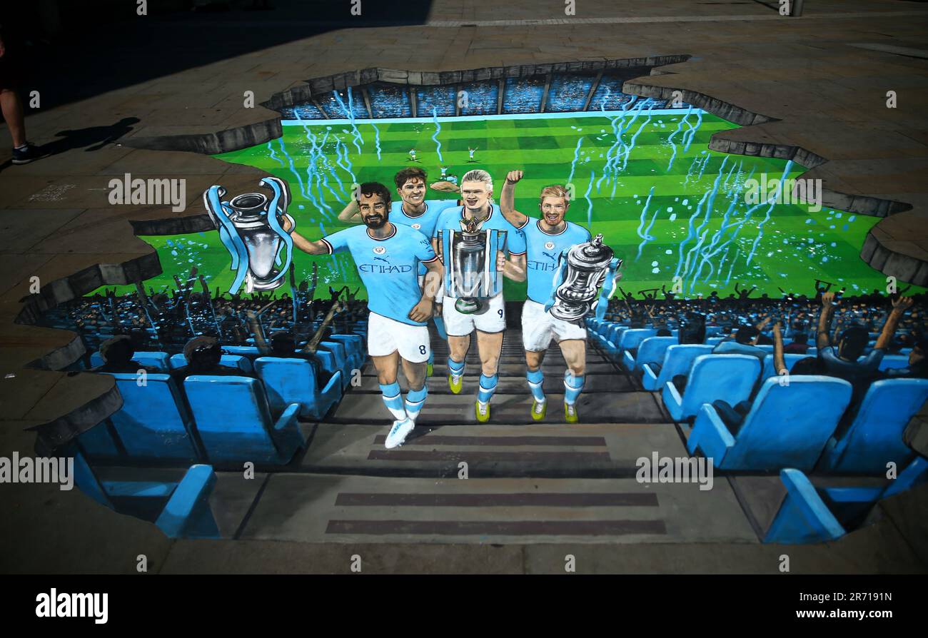 A mural on New Cathedral Street depicting Manchester City players ...