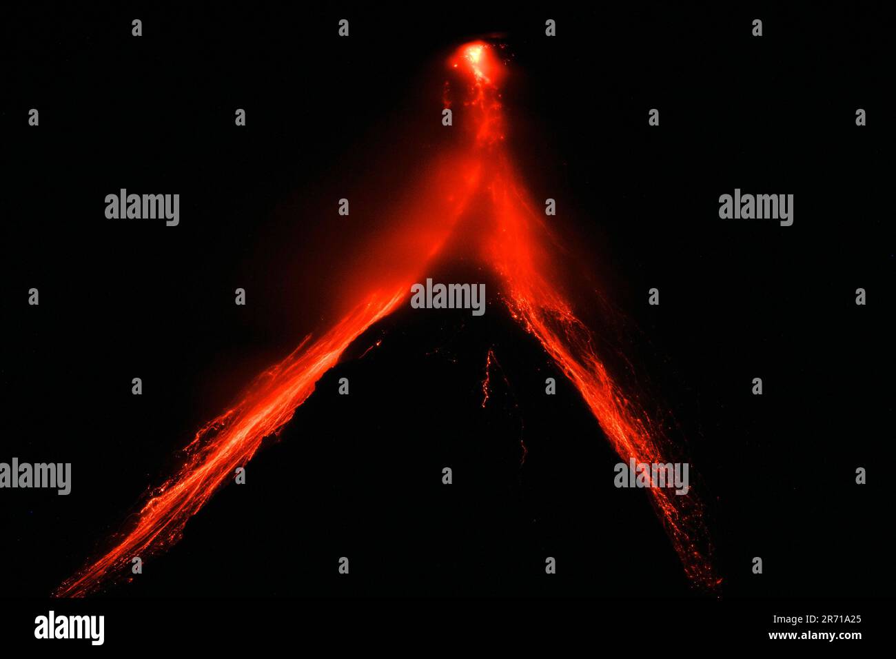 Mayon Volcano spews lava as seen from Legaspi, Albay province ...
