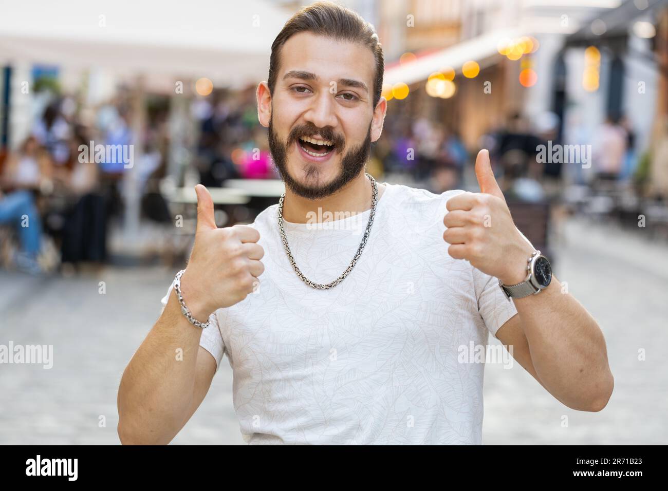 Like. Happy bearded young man looking approvingly at camera showing ...