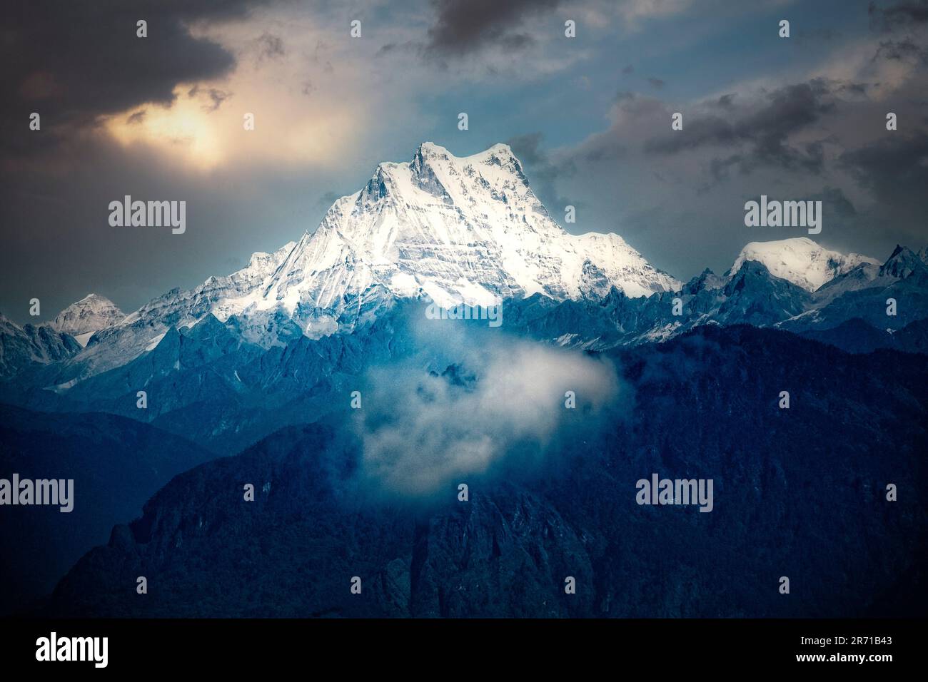 Snow covered Masang Gang at 7,194 meters in the eastern Himalaya on the ...
