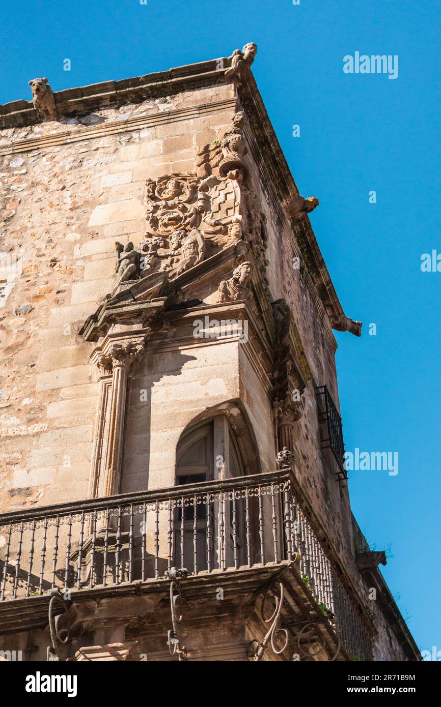 A tall, multi-story brick building with multiple balconies running ...