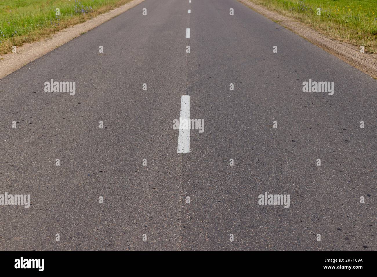 Narrow paved road for cars, part of a modern paved expressway for motor ...