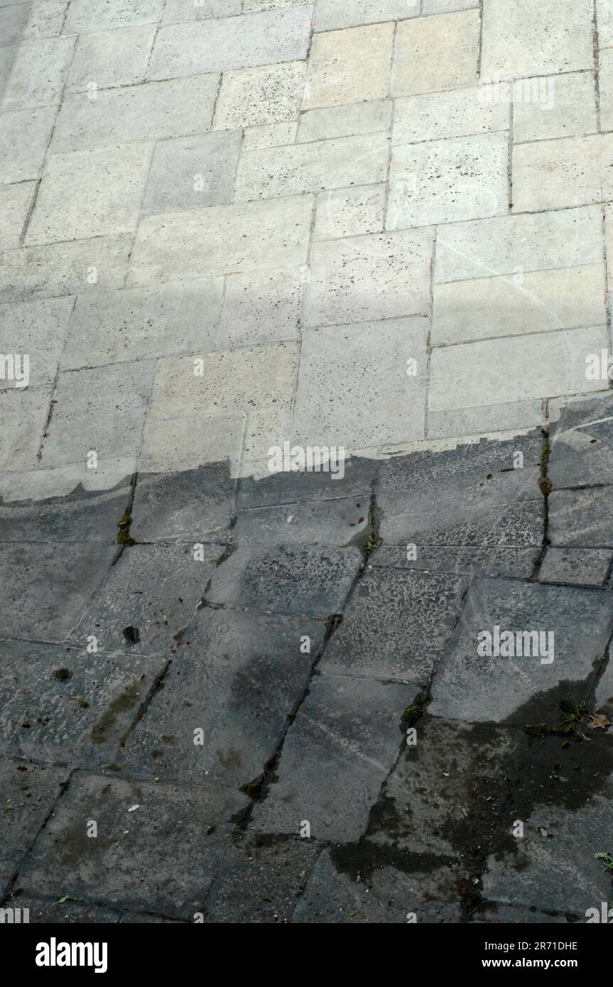 Terrace maintenance. Cleaning a terrace with a high pressure cleaner to ...