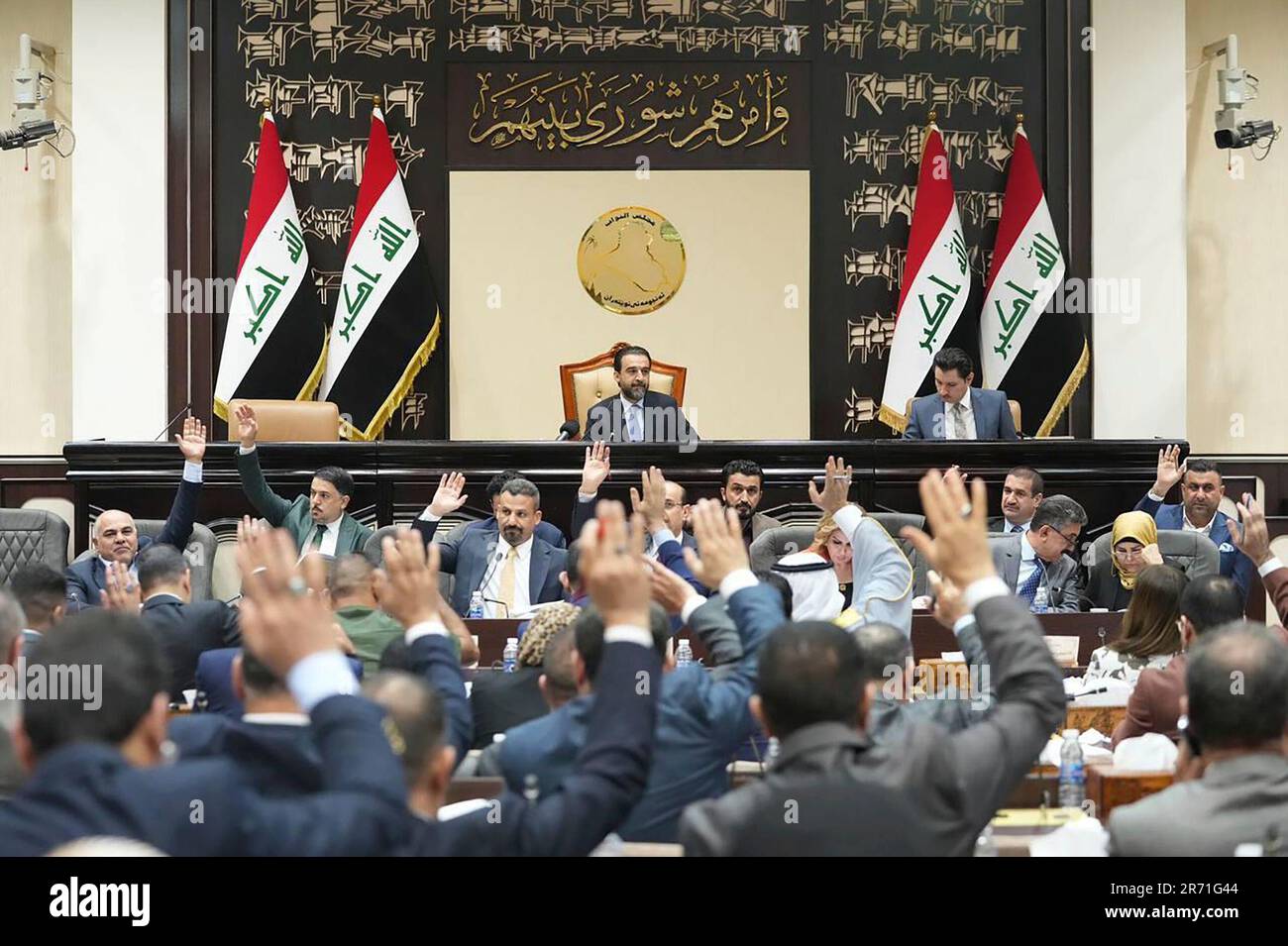 This photo from Iraqi parliament shows the Iraqi lawmakers attend a ...