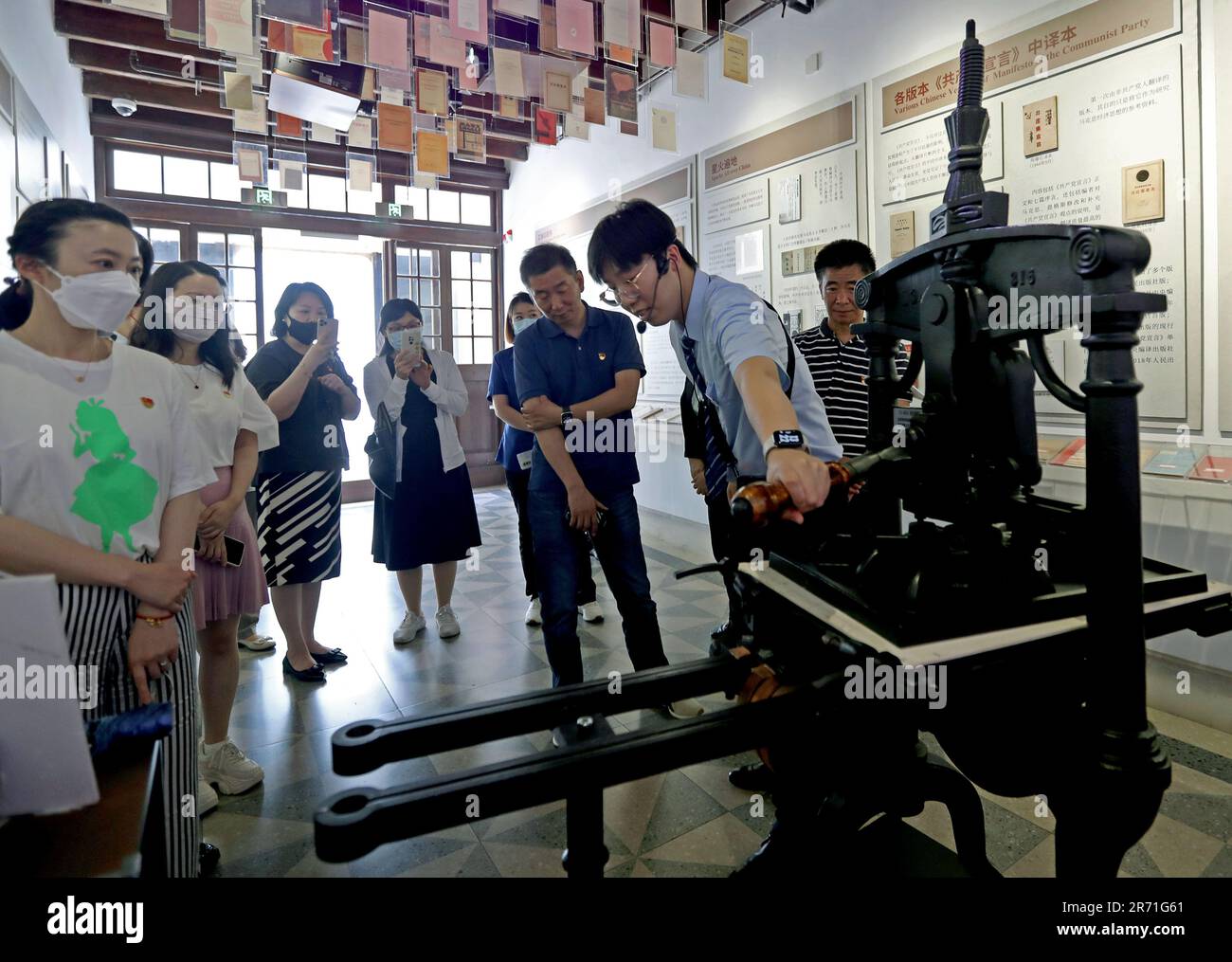 Shanghai. 9th June, 2023. Visitors look at a hand-operated printing ...