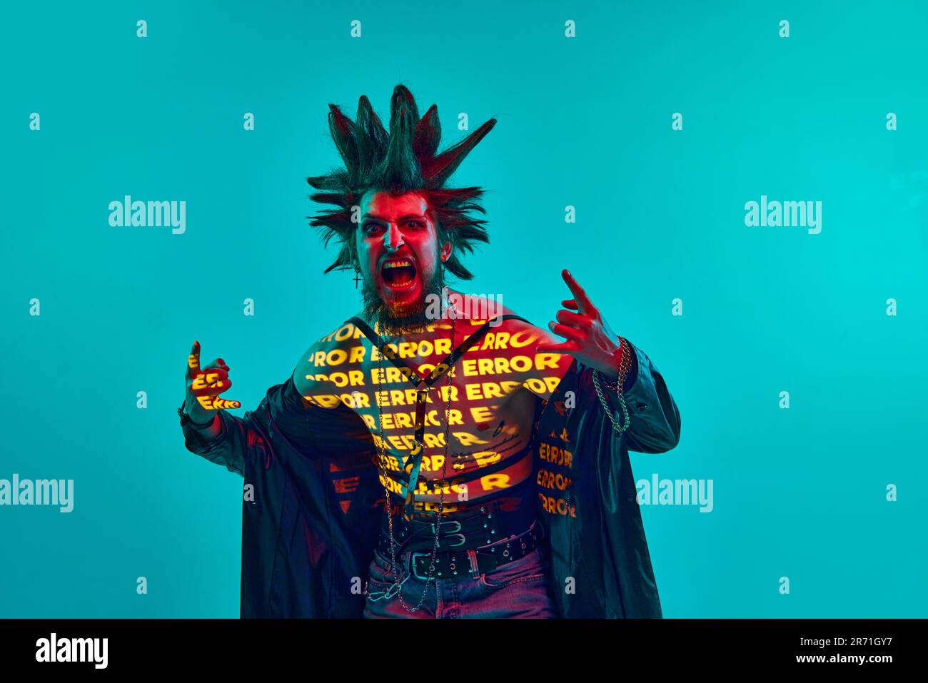 Rock and roll. Young man, rock musician, punk with neon filter ...