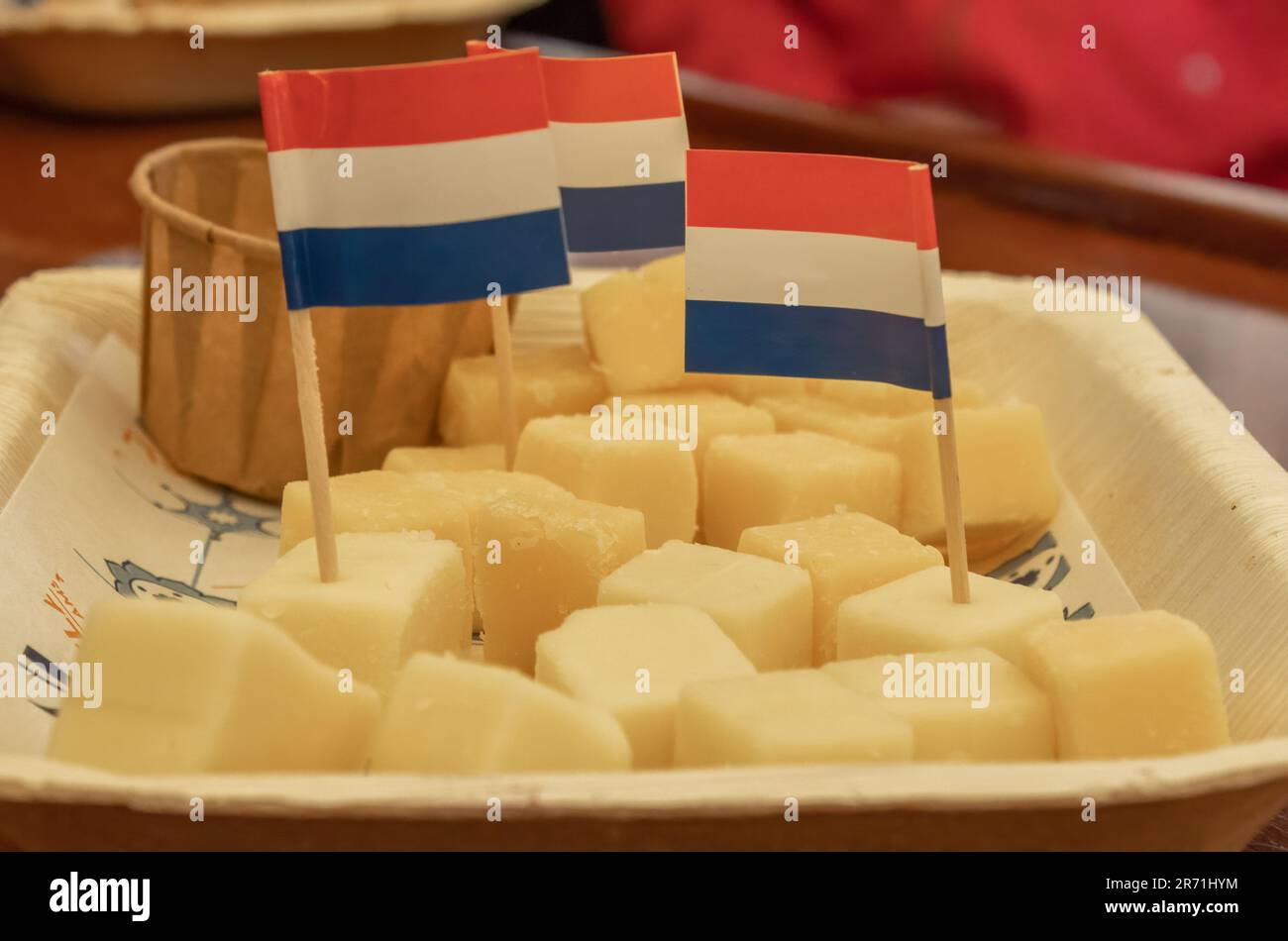 The Edam cheese squares with flags of Holland on wooden sticks on a ...