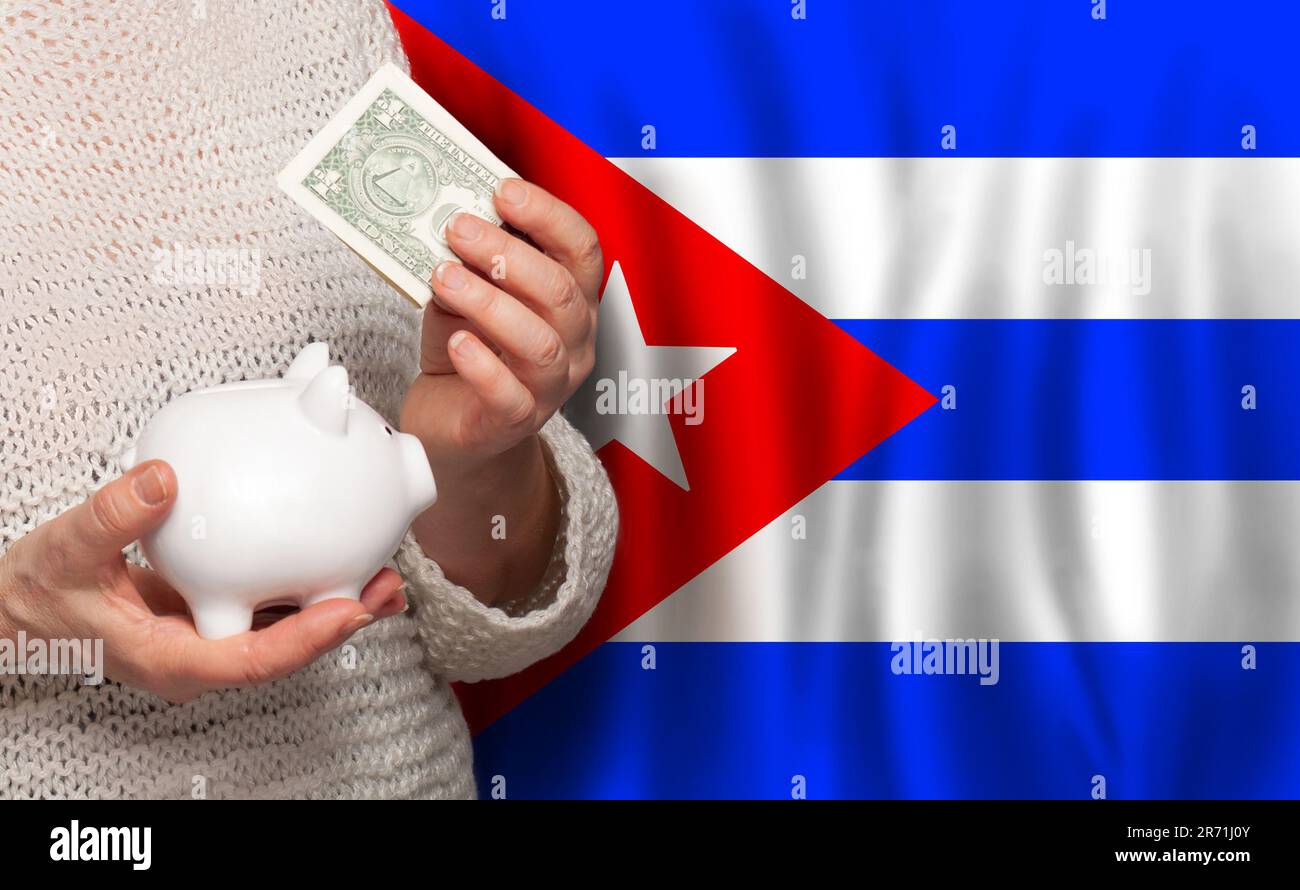 Cuban woman with money bank on the background of Cuba flag. Dotations ...