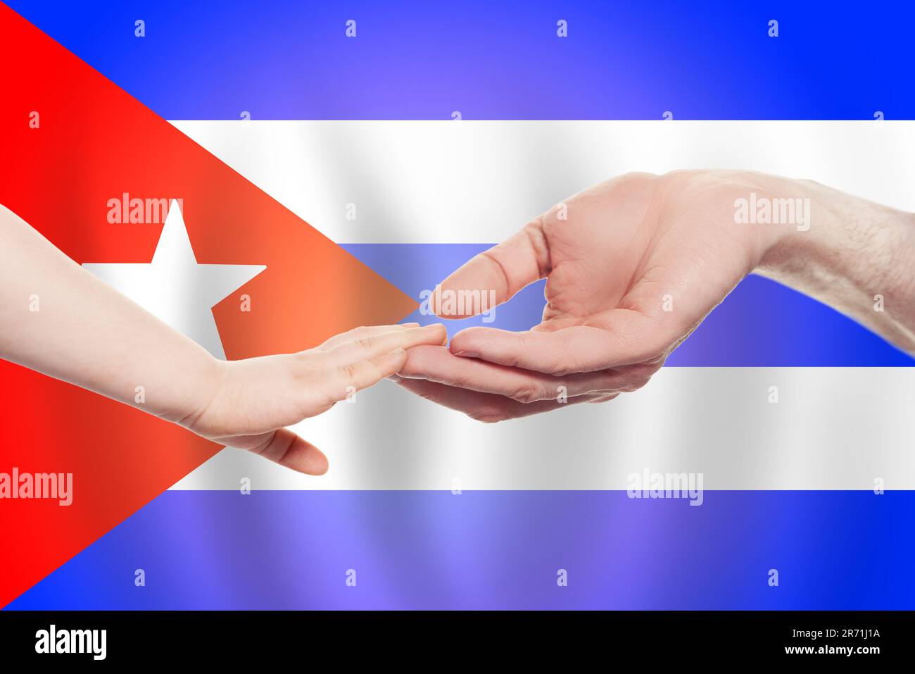 Cuban baby and parent hands on the background of flag of Cuba Help, aid ...
