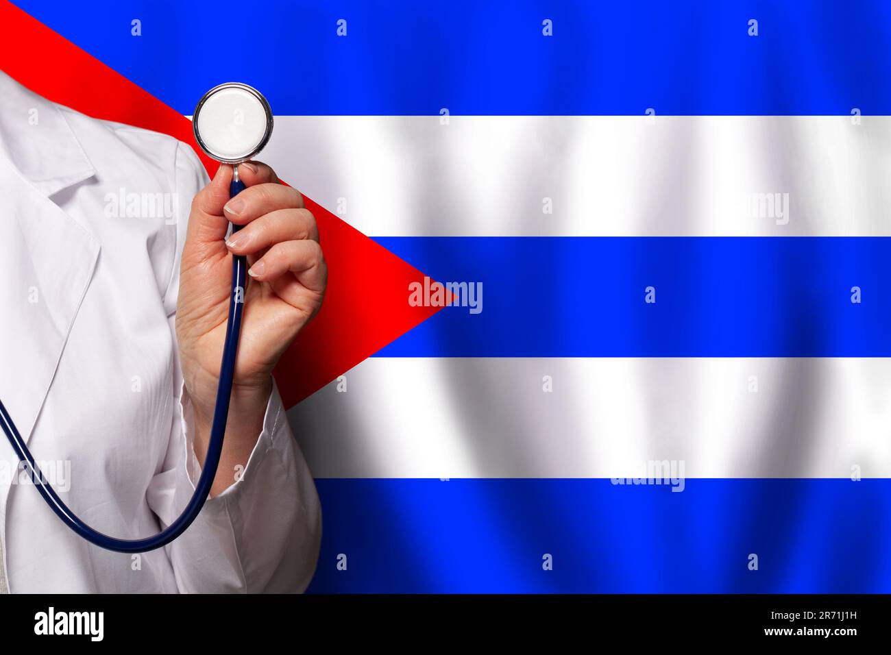 Cuban doctor's hand with stethoscope on the background of flag of Cuba ...