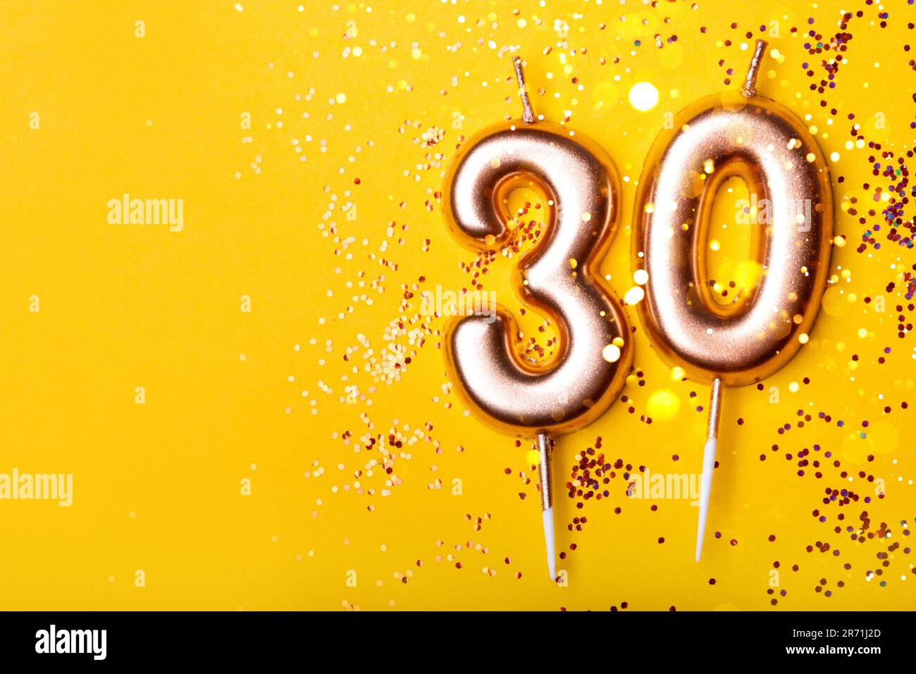 30 years celebration. Greeting banner. Gold candles in the form of ...