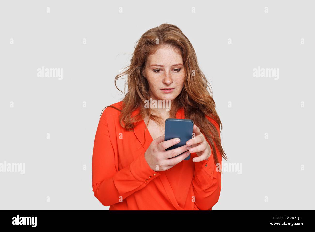 Attractive woman using app on her smartphone on white background Stock ...