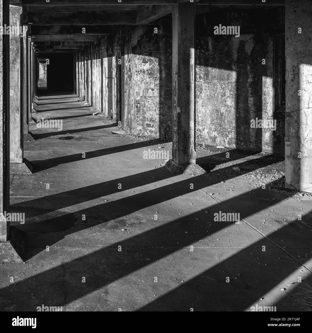 Shadows along a corridor in the now closed Fort Monroe coastal defense ...