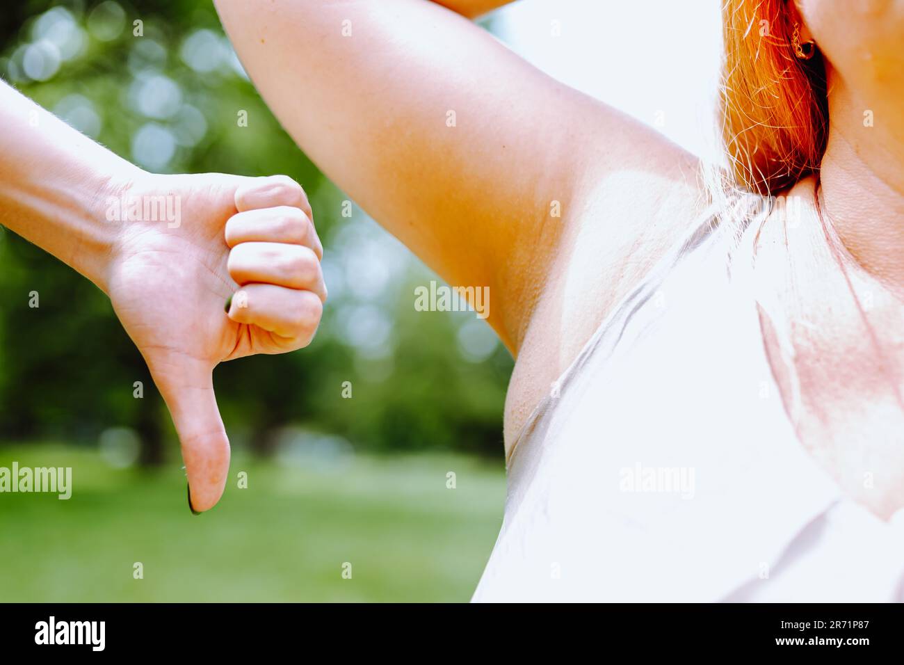Sweaty armpit woman with wet spot on clothes Stock Photo - Alamy