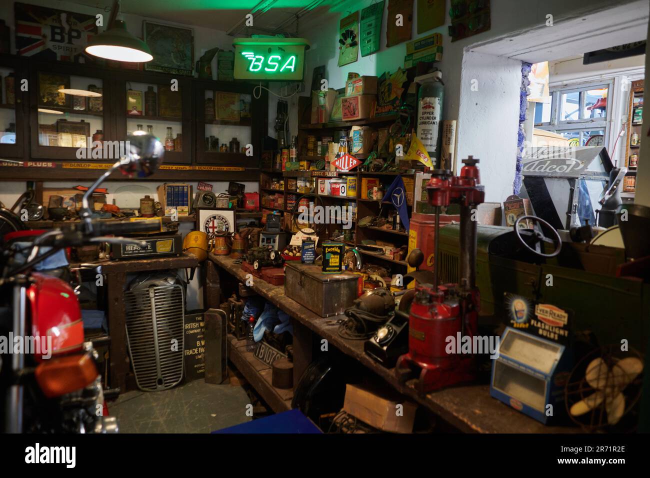 An Old fashioned mechanics workshop garage full of vintage parts for ...