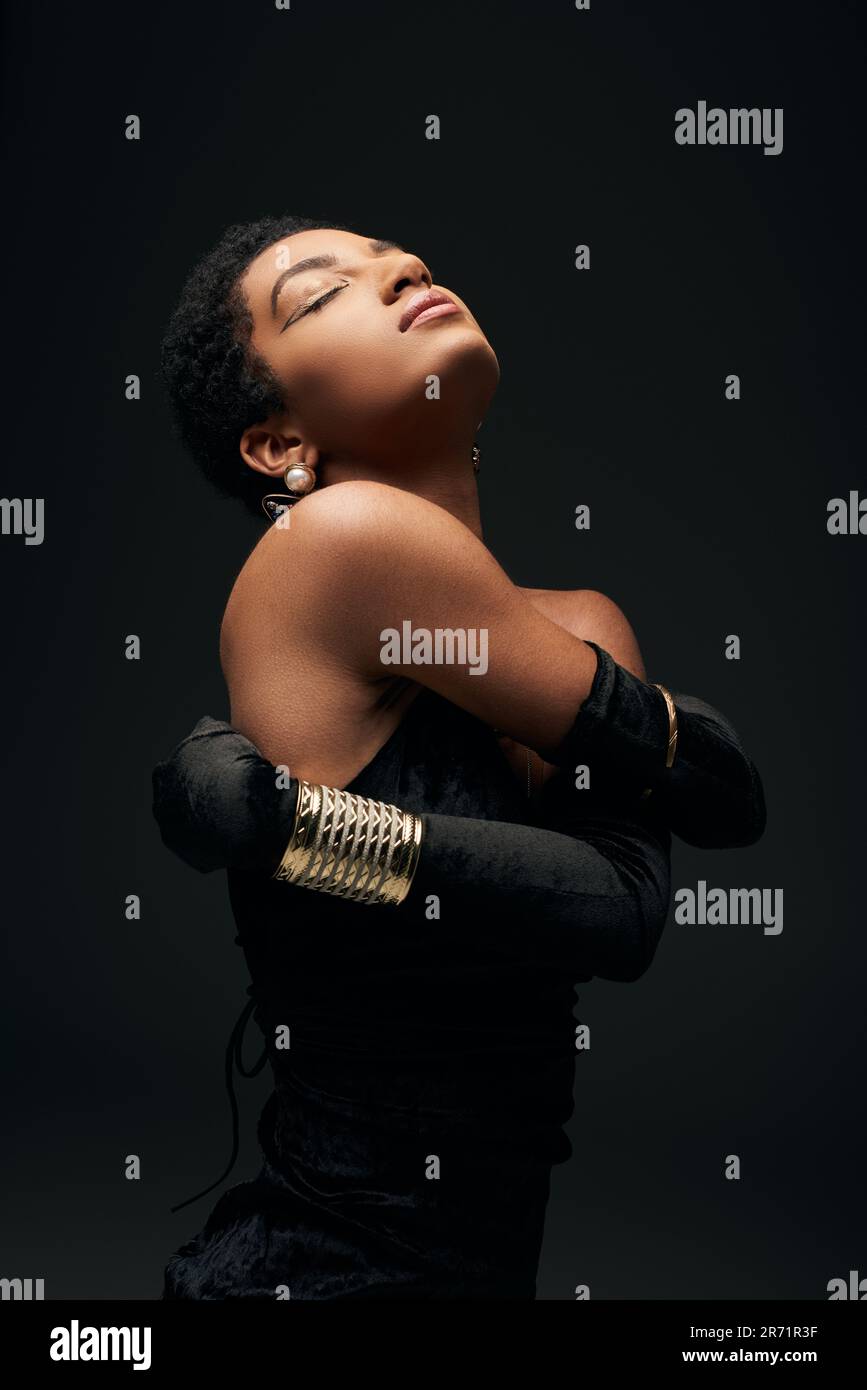 Short Haired African American Woman With Evening Makeup Wearing Gloves