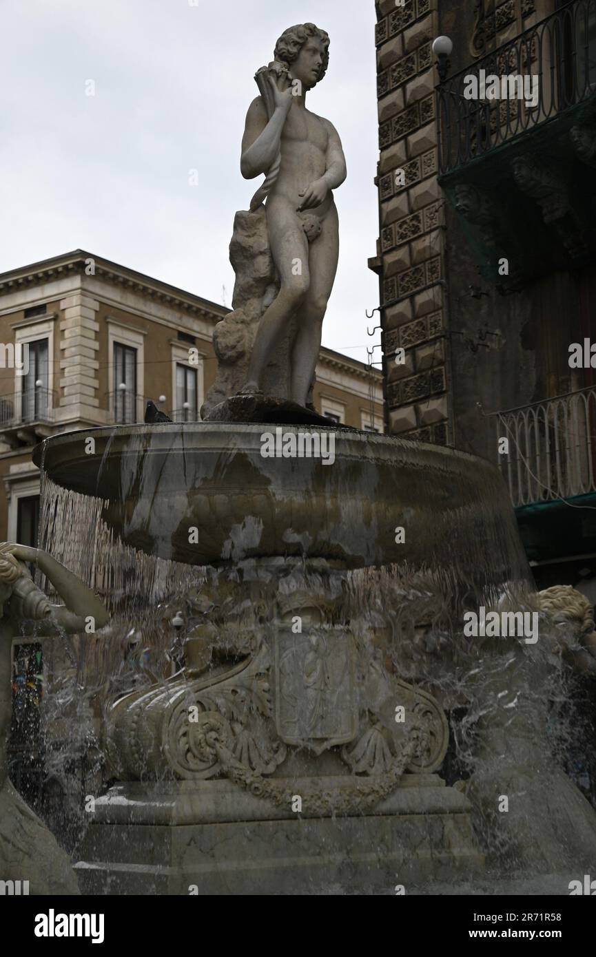 Cityscape with scenic view of the Carrara marble Fontana dell'Amenano a water fountain and ...