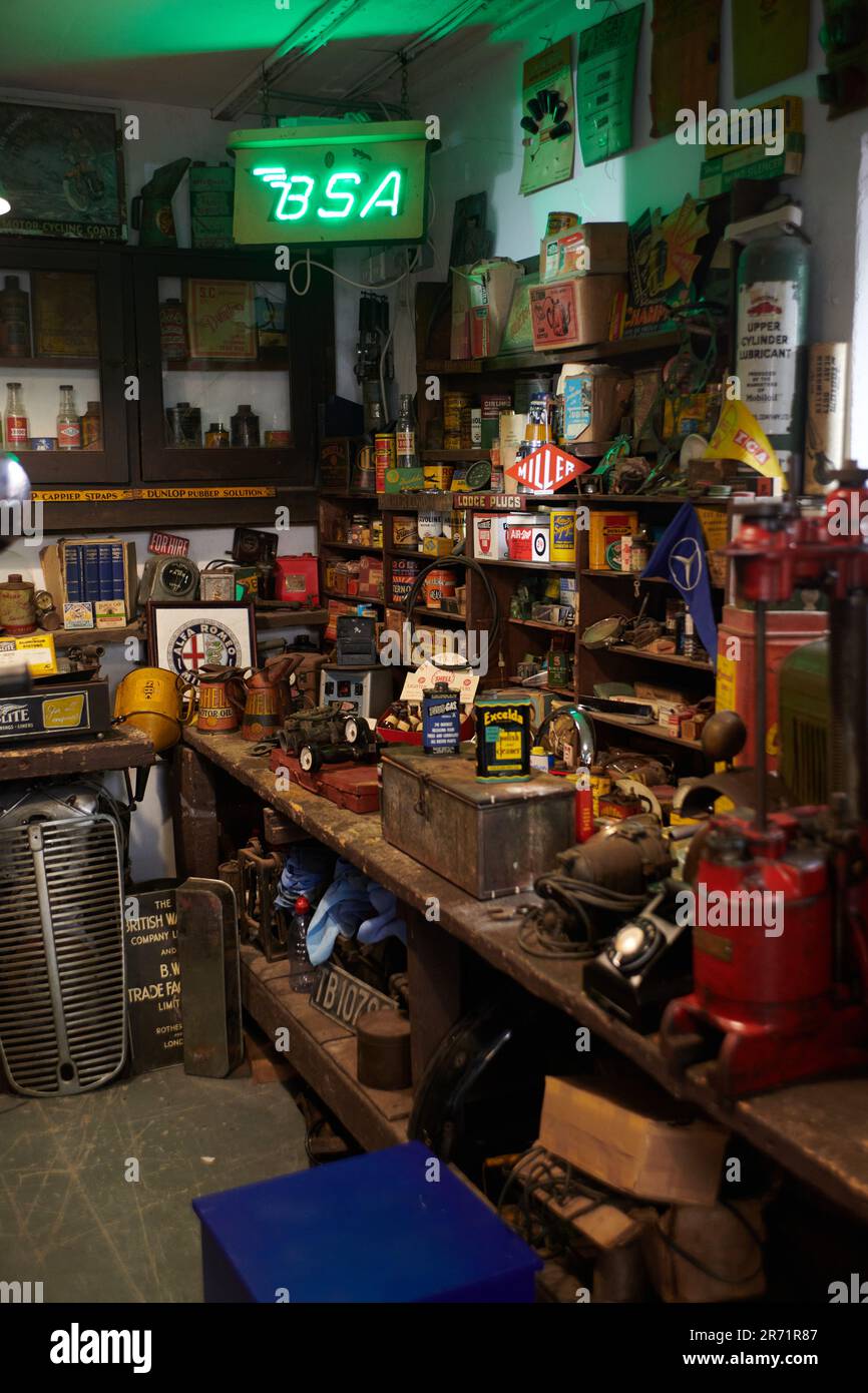 An Old fashioned mechanics workshop garage full of vintage parts for ...