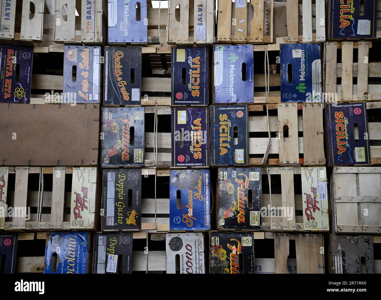 Wooden storage crates loaded on the back of a truck at the farmer's ...