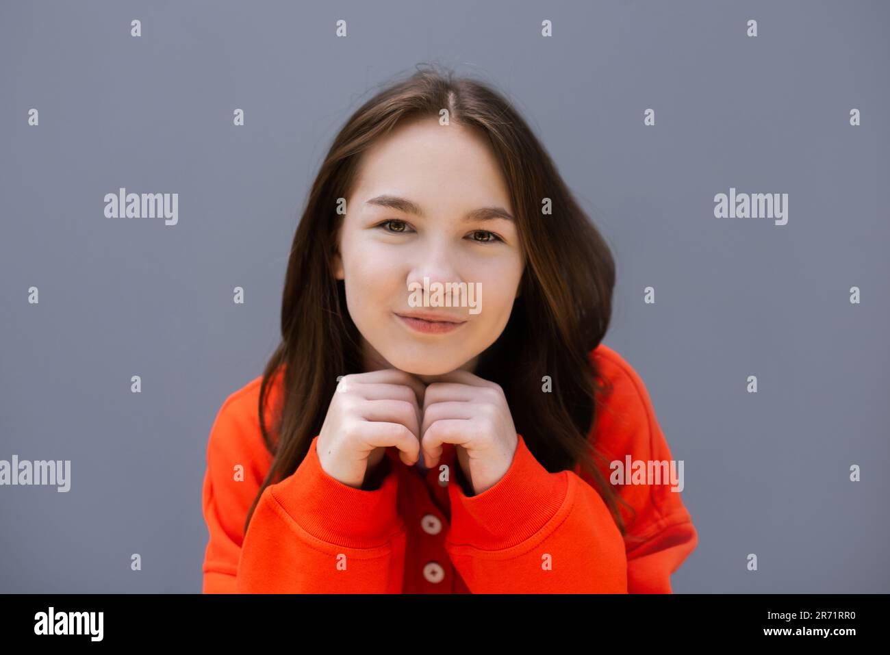 friendly teen girl or university student smiling happily at camera ...