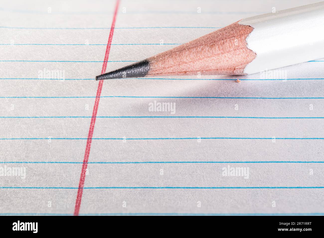 High resolution macro photograph of a pencil on lined school paper ...
