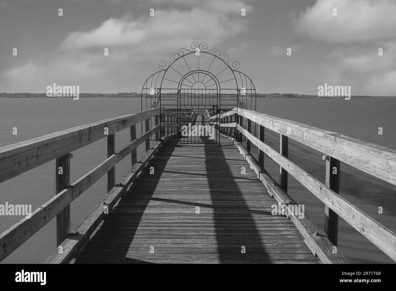 Dock with an ornate gate along the waterfront Stock Photo - Alamy