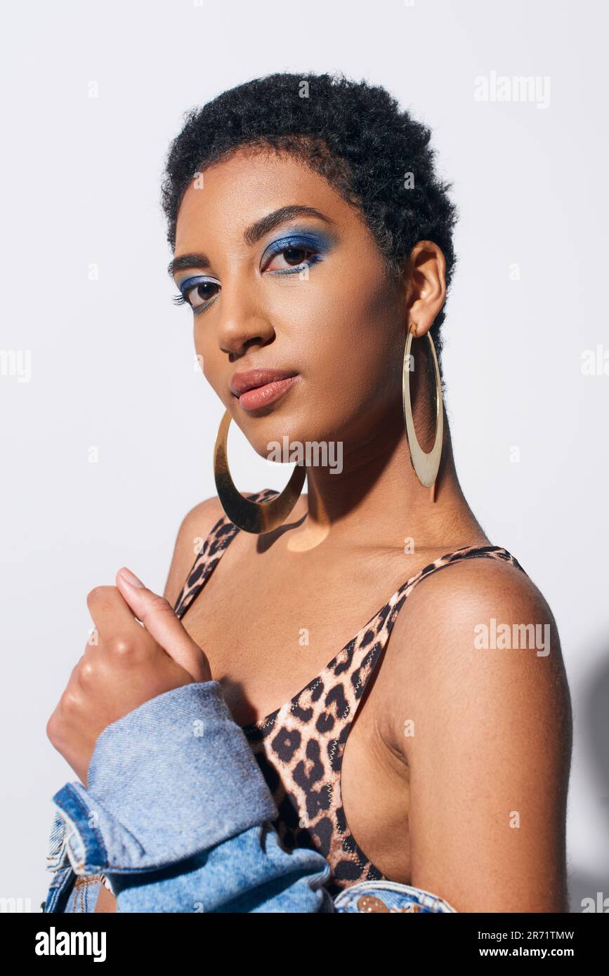 Portrait Of Short Haired African American Woman With Bold Makeup And