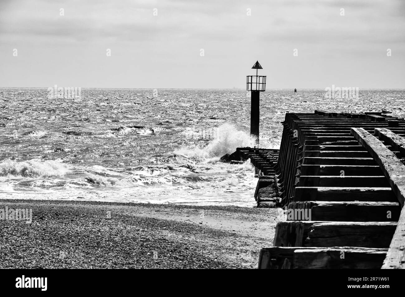 Waves hit the former timber railway jetty at Landguard Point ...
