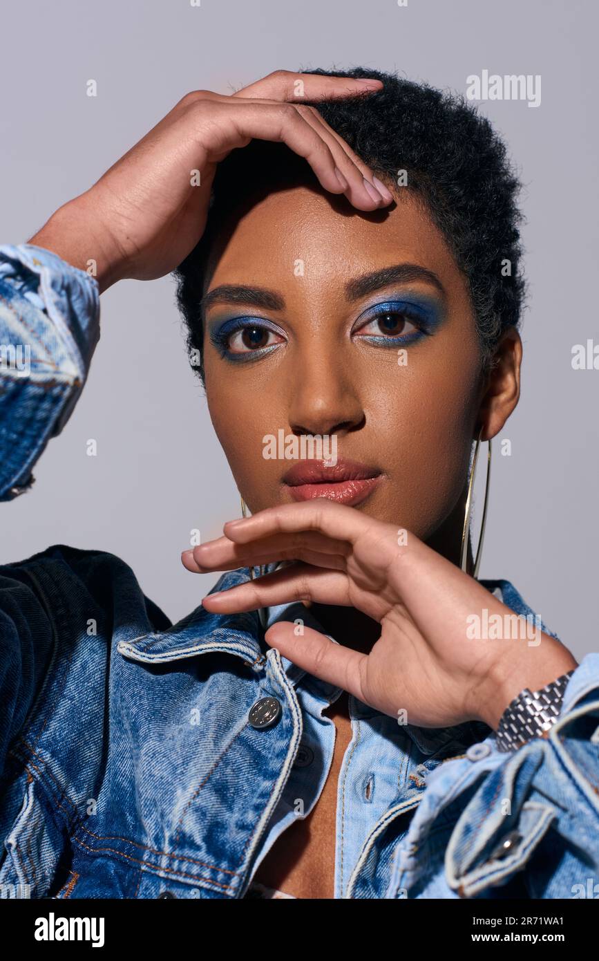 Portrait of modern african american woman with short hair and bold ...