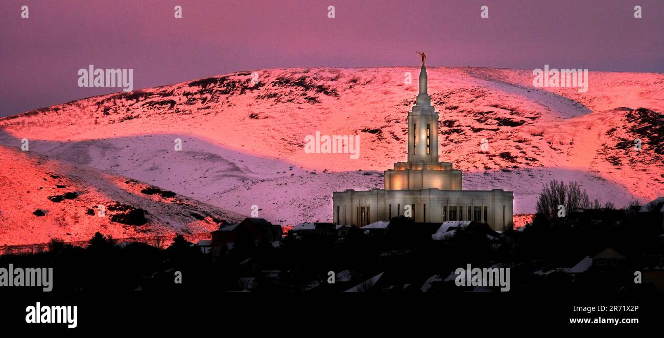 Pocatello LDS Mormon Temple in winter at sunset with golden orange ...