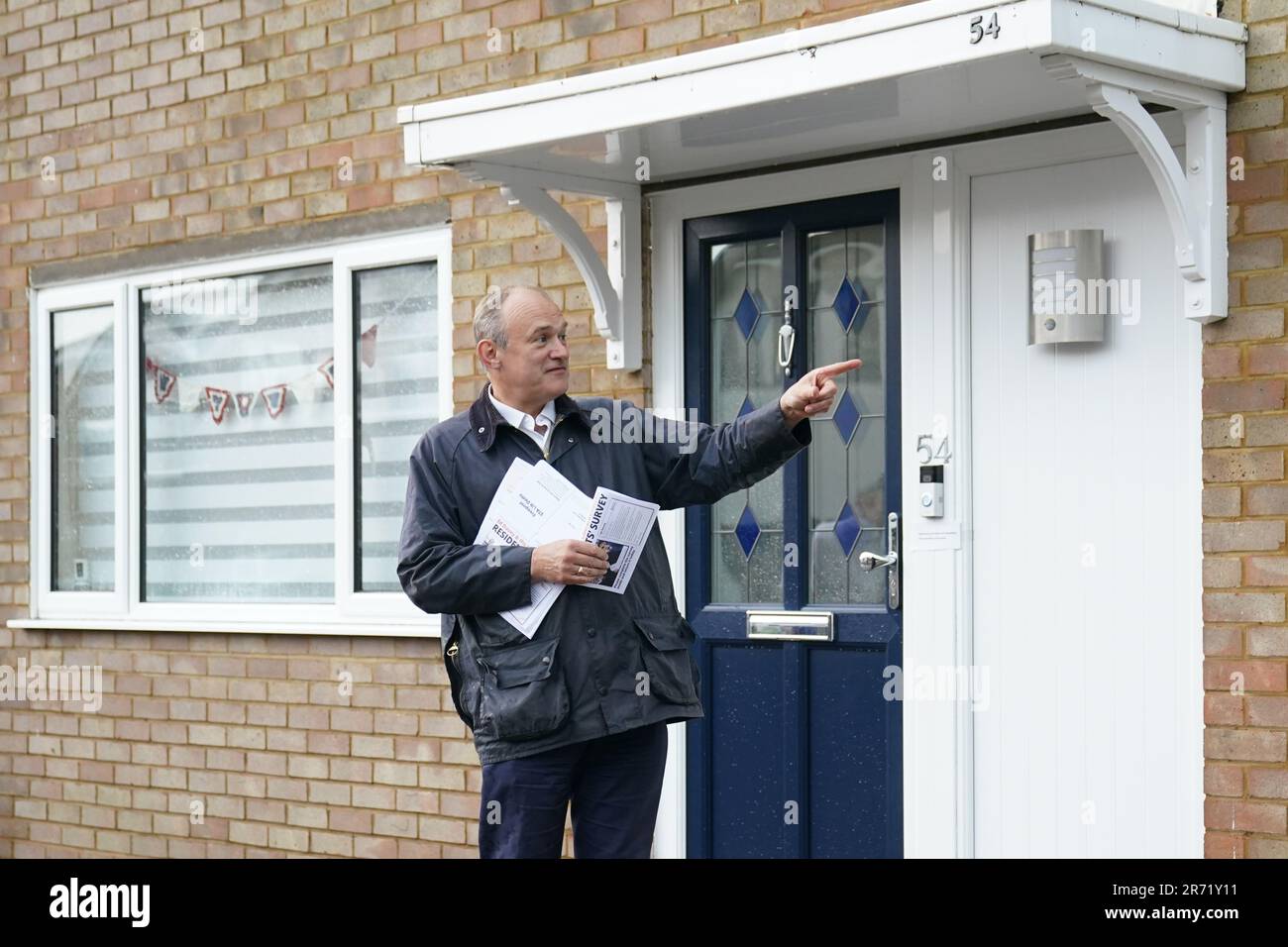 Liberal Democrat leader Sir Ed Davey speaks to residents in Ampthill ...