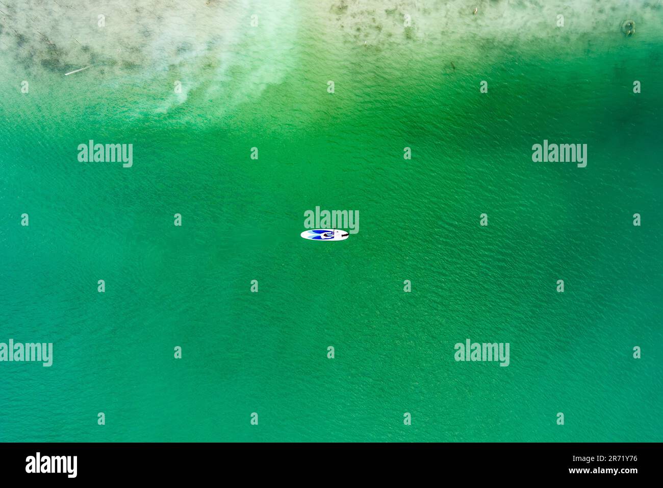 Aerial top down view of beautiful green waters of lake Gela. Birds eye ...