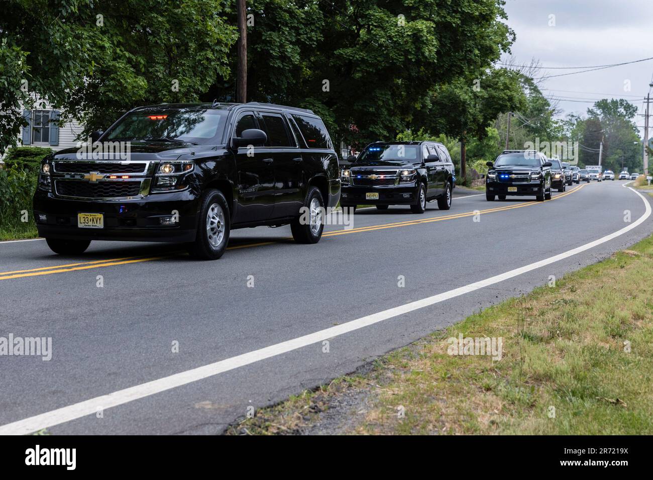 The motorcade for former President Donald Trump passes through the ...