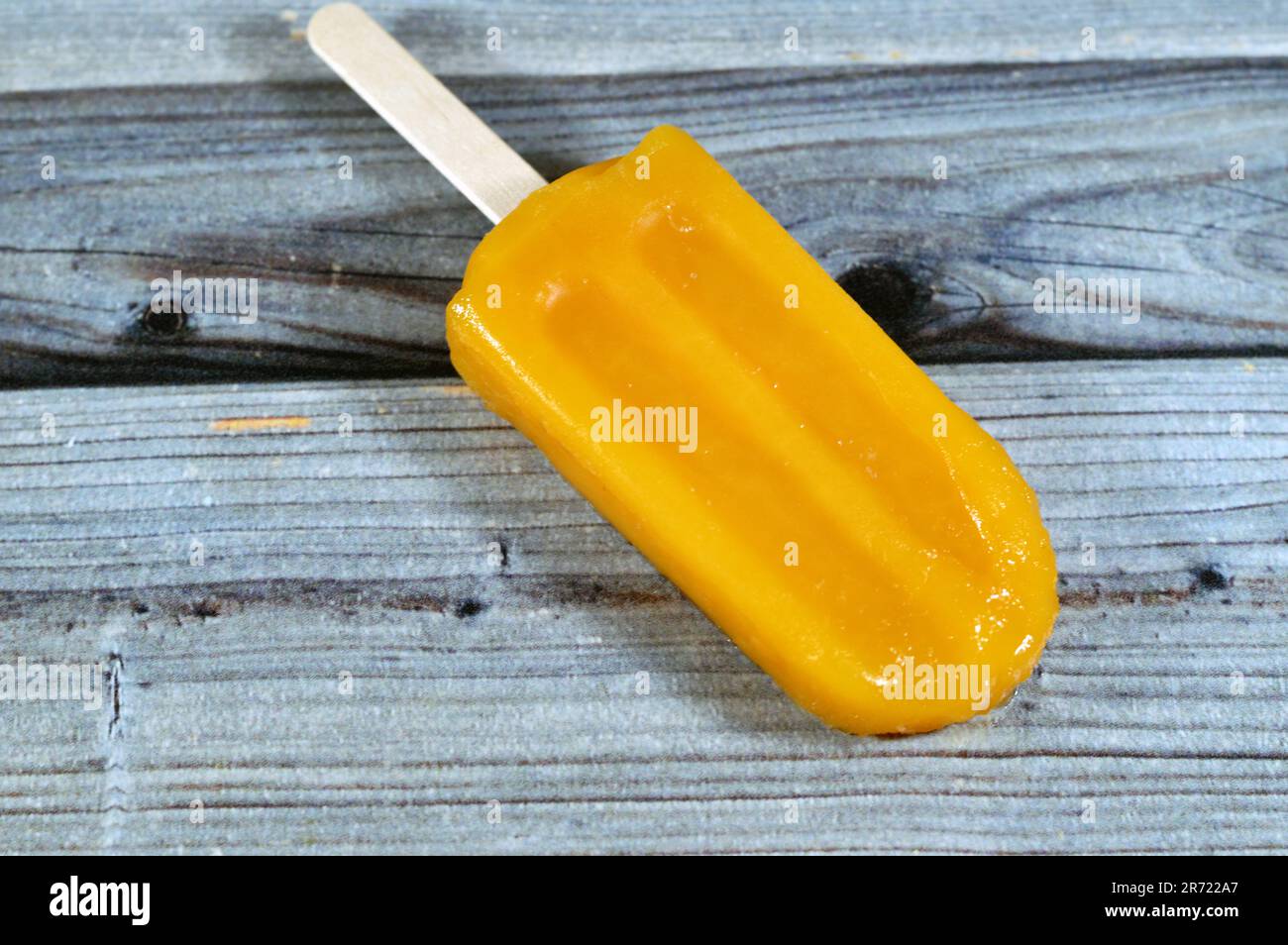 Mango Frozen ice cream stick, a creamy and delicious frozen dessert, concept of confectionary ...