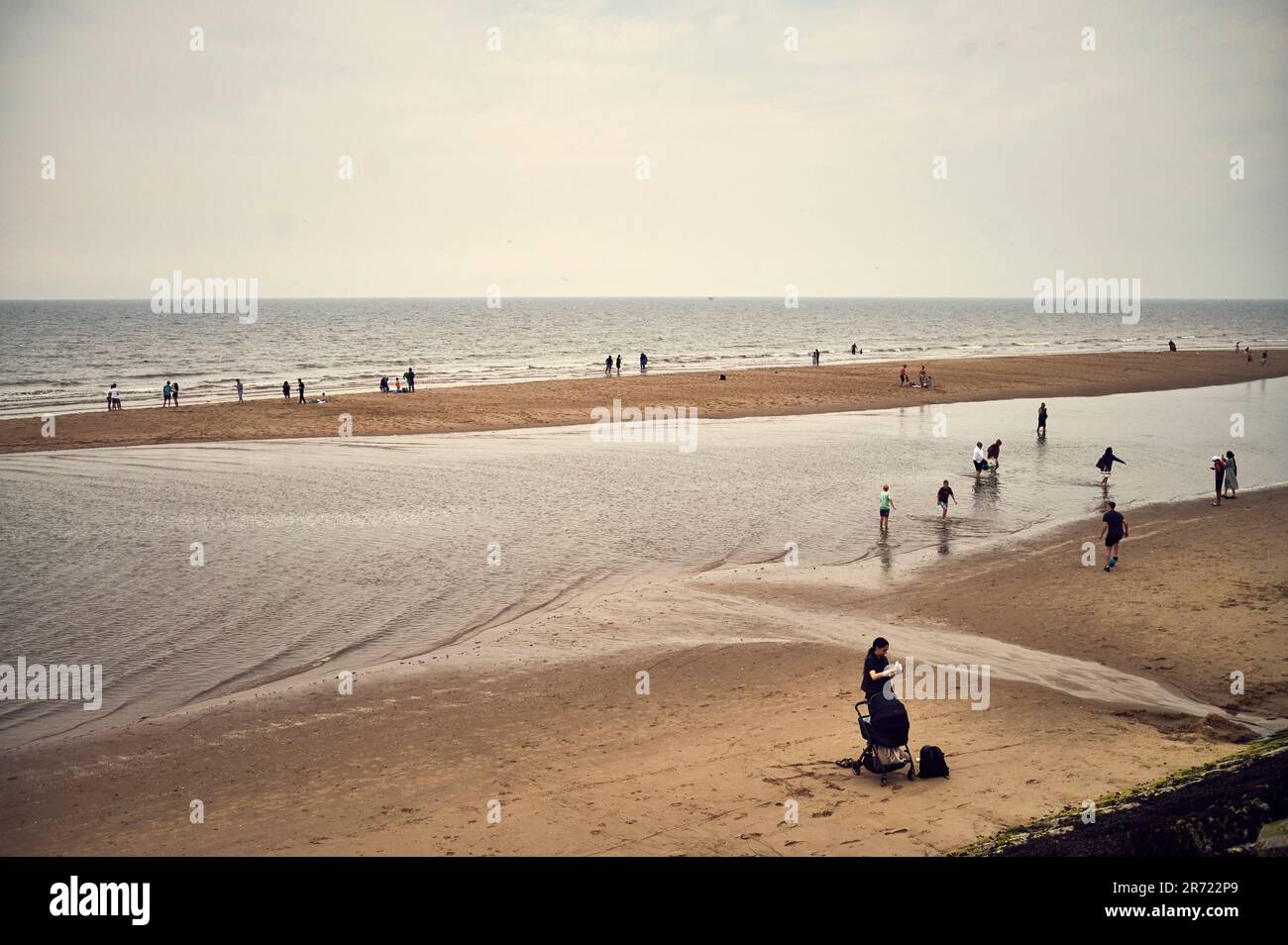 Tide comes in on beach users at Blackpool,UK Stock Photo - Alamy