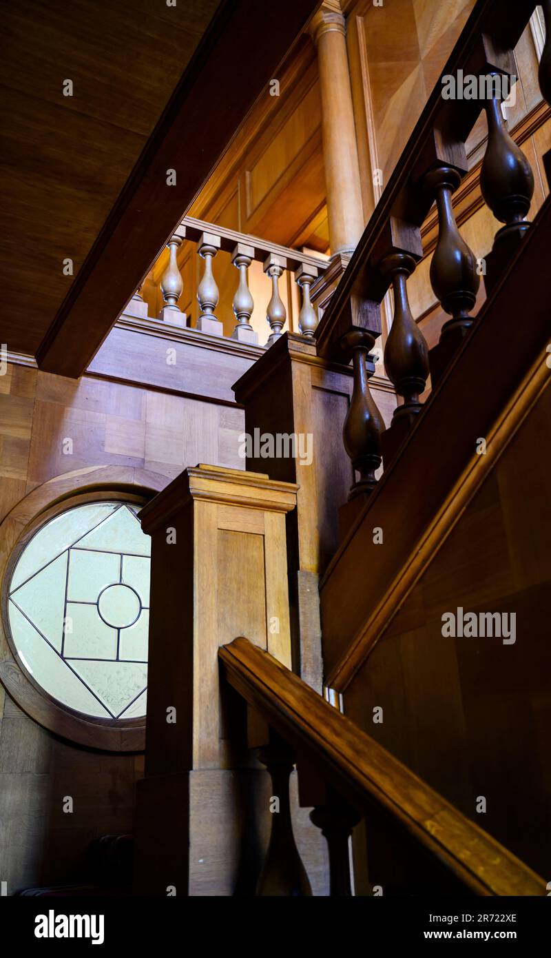 Interior in wood with a staircase of the 30s of the 20th century in the ...