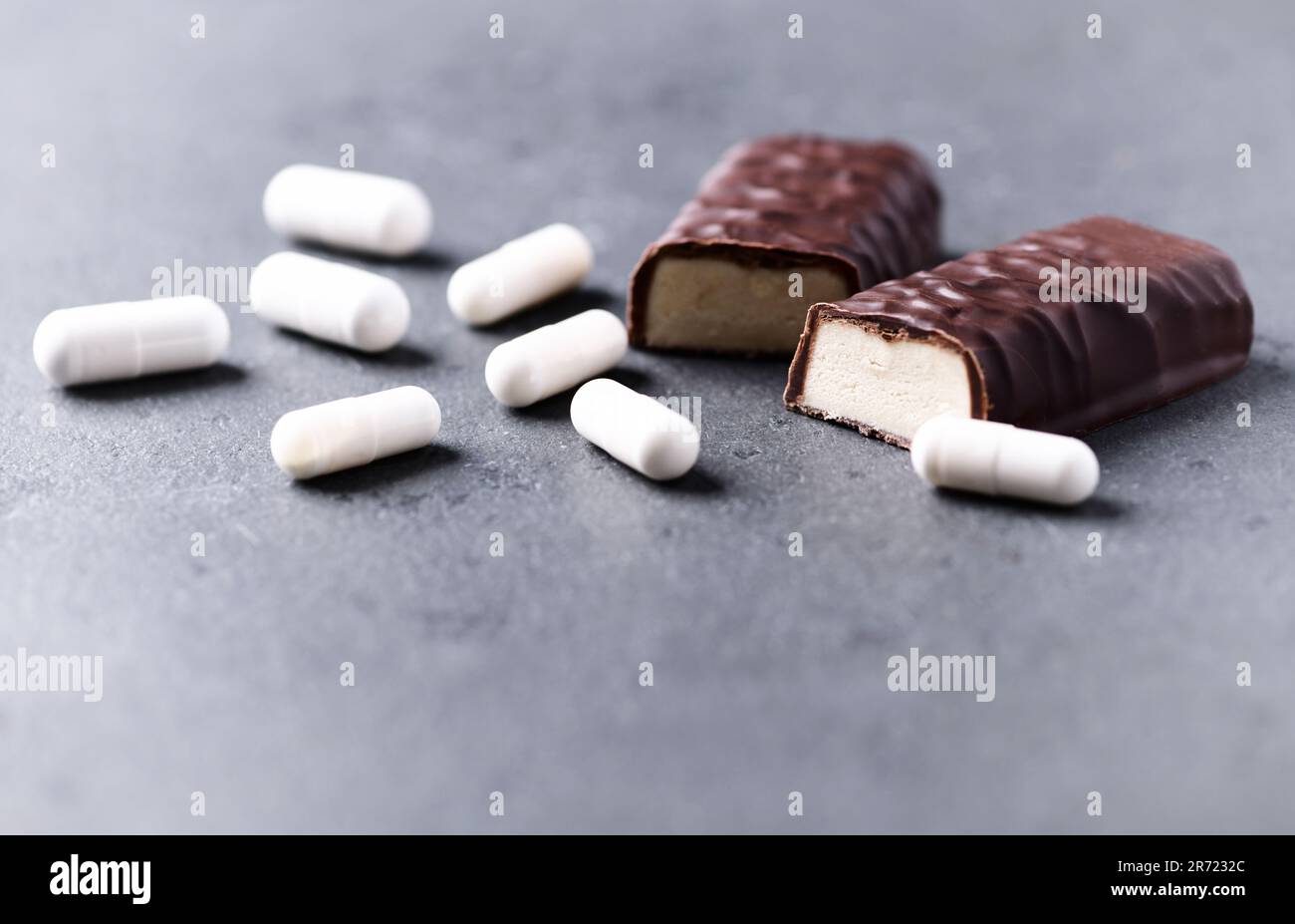 High Protein bar and creatine capsules. Bodybuilding food supplements ...