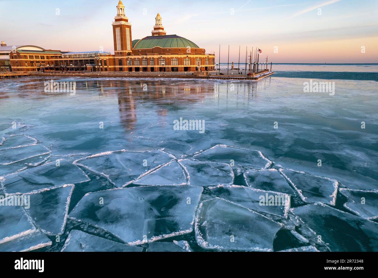 An aerial Chicago skyline at sunrise with a view of the navy pier and ...