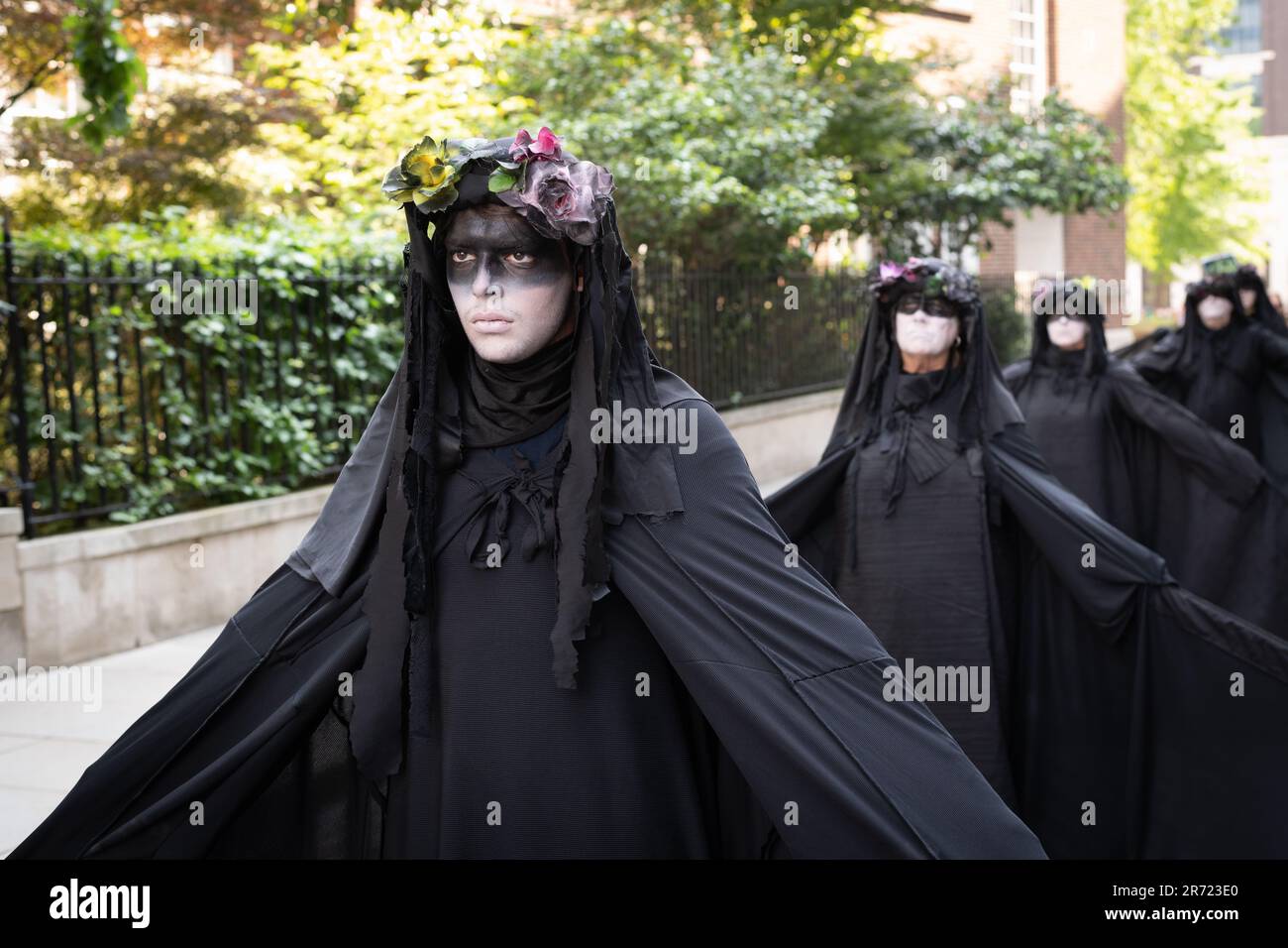 London, UK. 12 June, 2023. Extinction Rebellion's "Oil Slickers ...