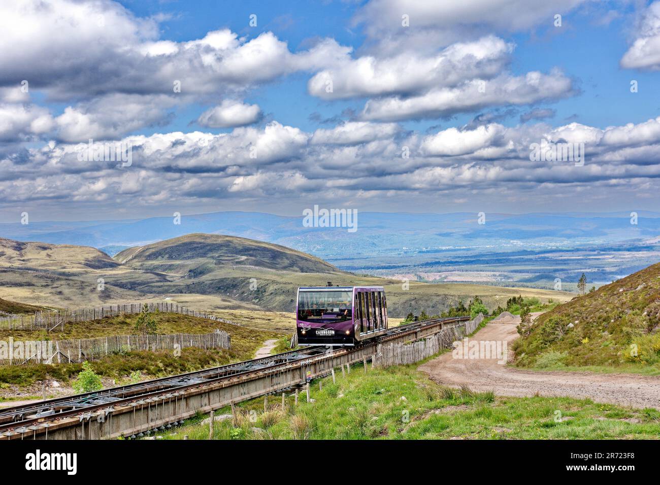 Aviemore Scotland early summer Cairngorm Mountain the Eagle funicular railway train leaving the ...