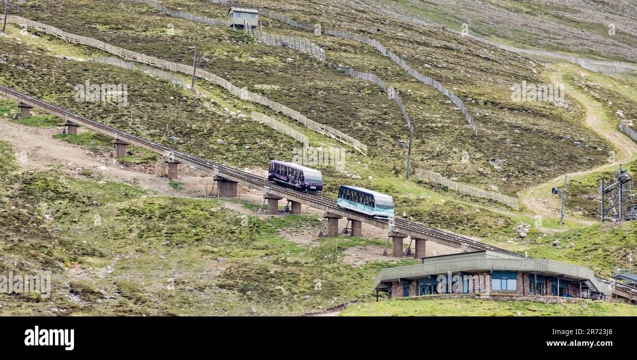 Aviemore Scotland early summer the Cairngorm Mountain funicular railway two trains passing each ...