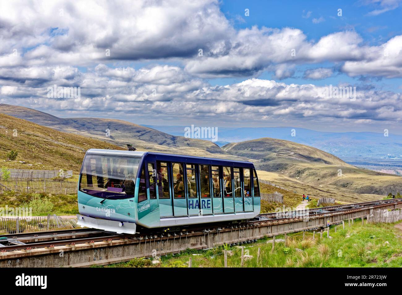 Aviemore Scotland early summer the Cairngorm Mountain Hare funicular railway train heading ...