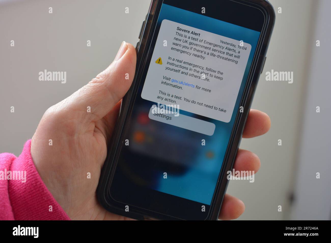 Cellphone In Hand With Screen Showing Text Received Yesterday Of Test