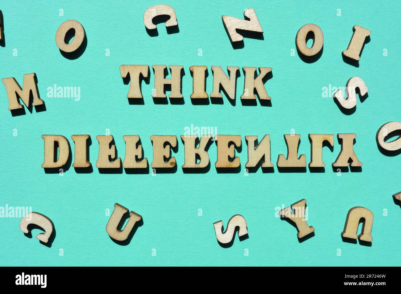Think Differently, words in wooden alphabet letters isolated on ...
