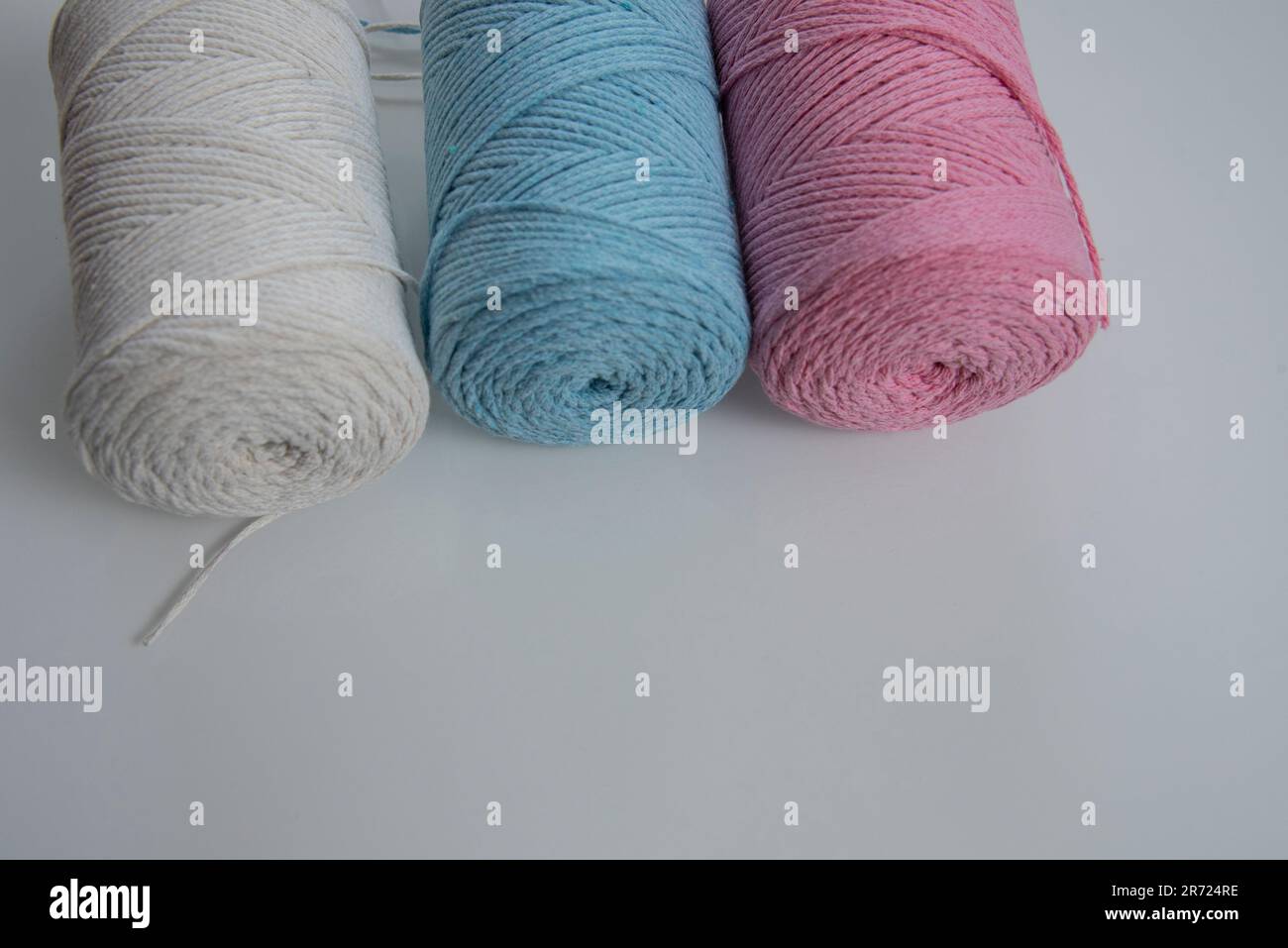 Color thread for kitting. Kitting concept.background Stock Photo - Alamy