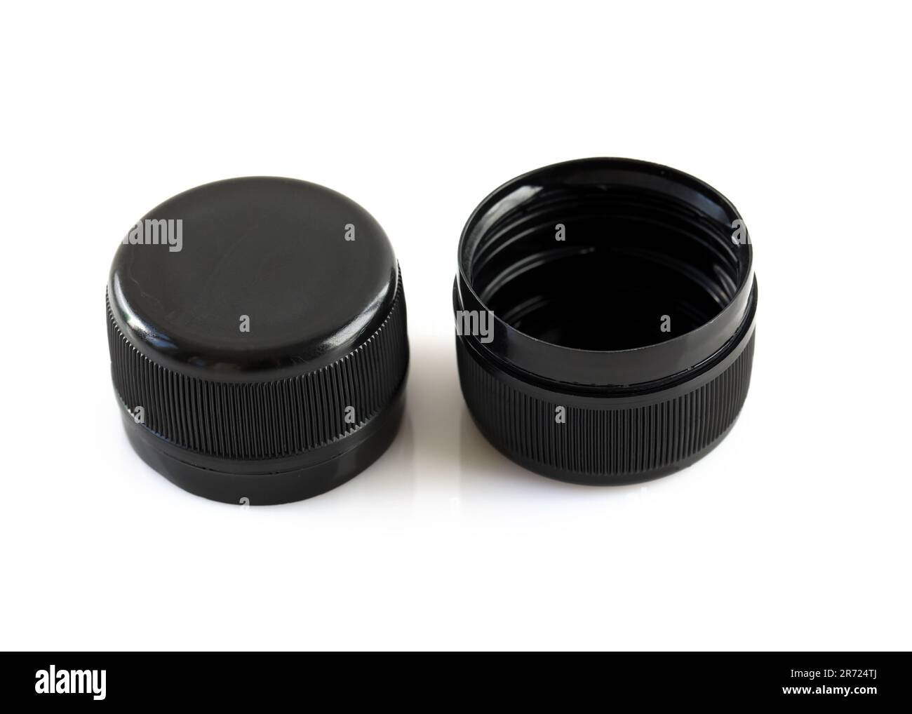 Two new black plastic caps on a white background. High dense plastic ...