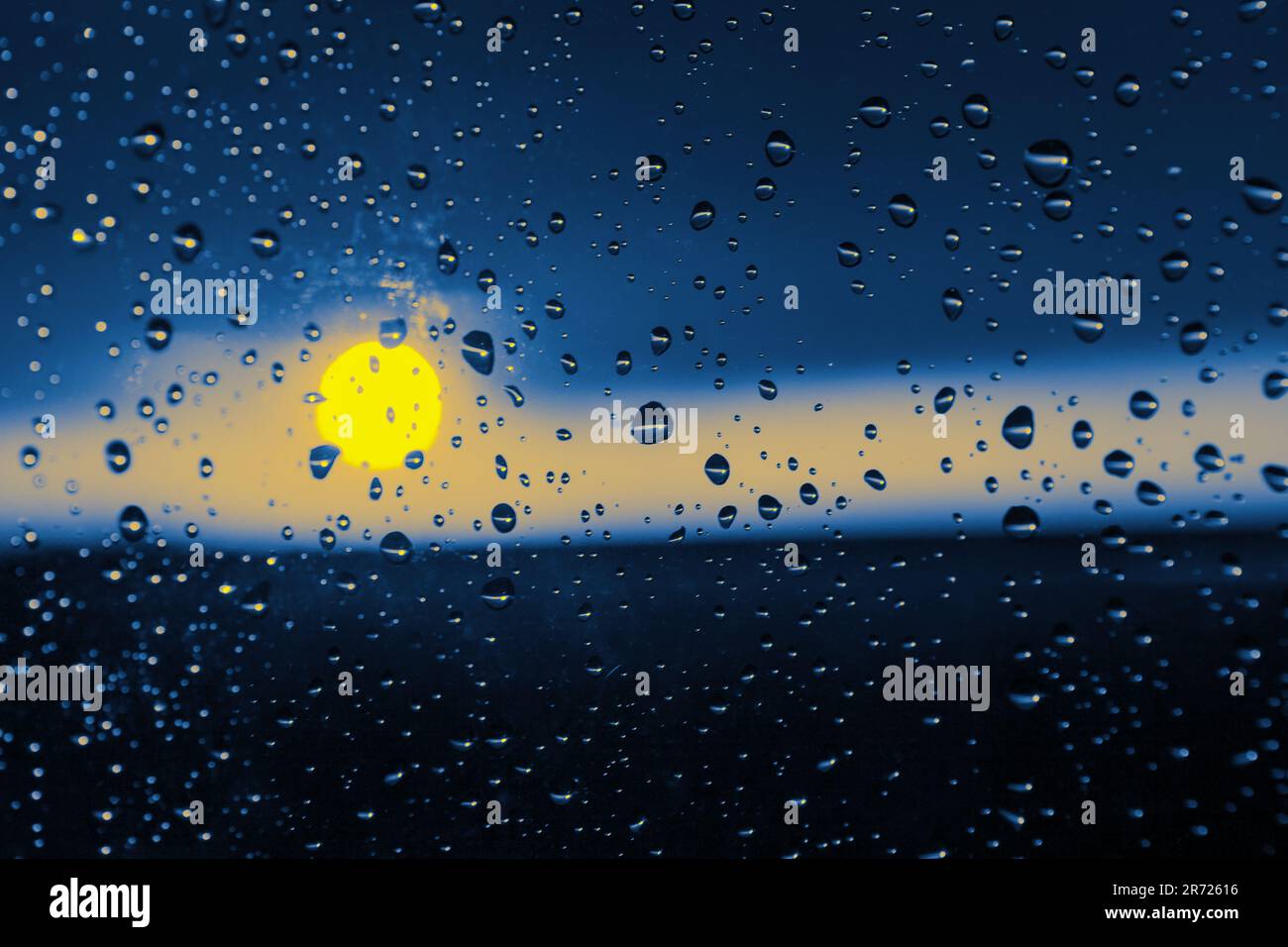 Rain drops on the glass with sunrise . Water drops at transparent ...
