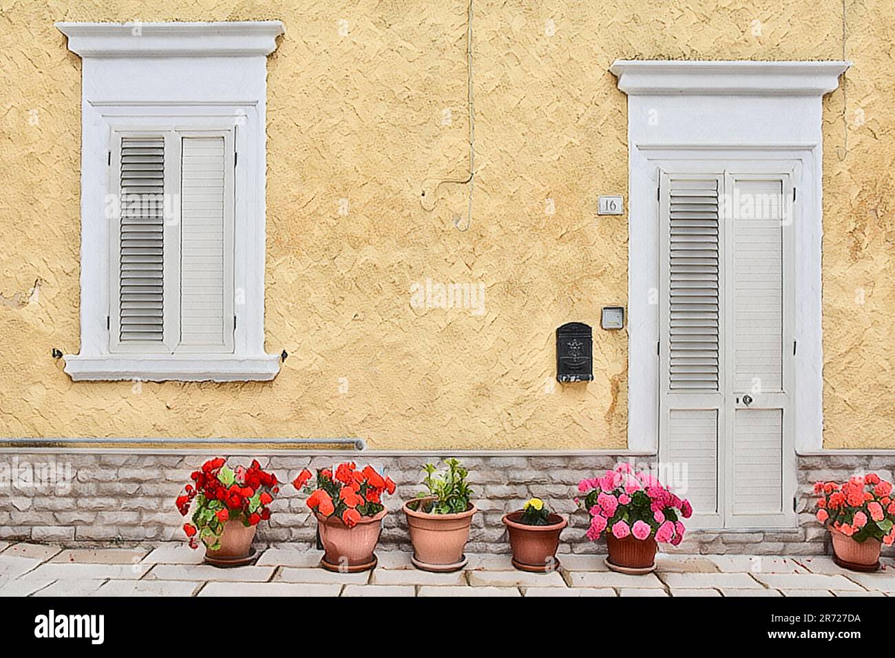 The entrance door and the windows of a house in Castro, a seaside ...