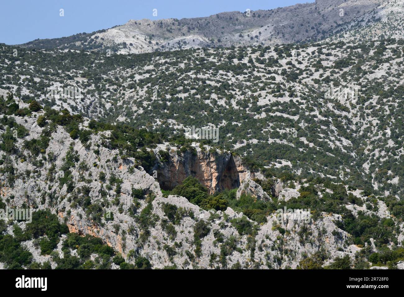 The path to cuile Sas Traes, view of Monte tiscali and its sinkhole ...