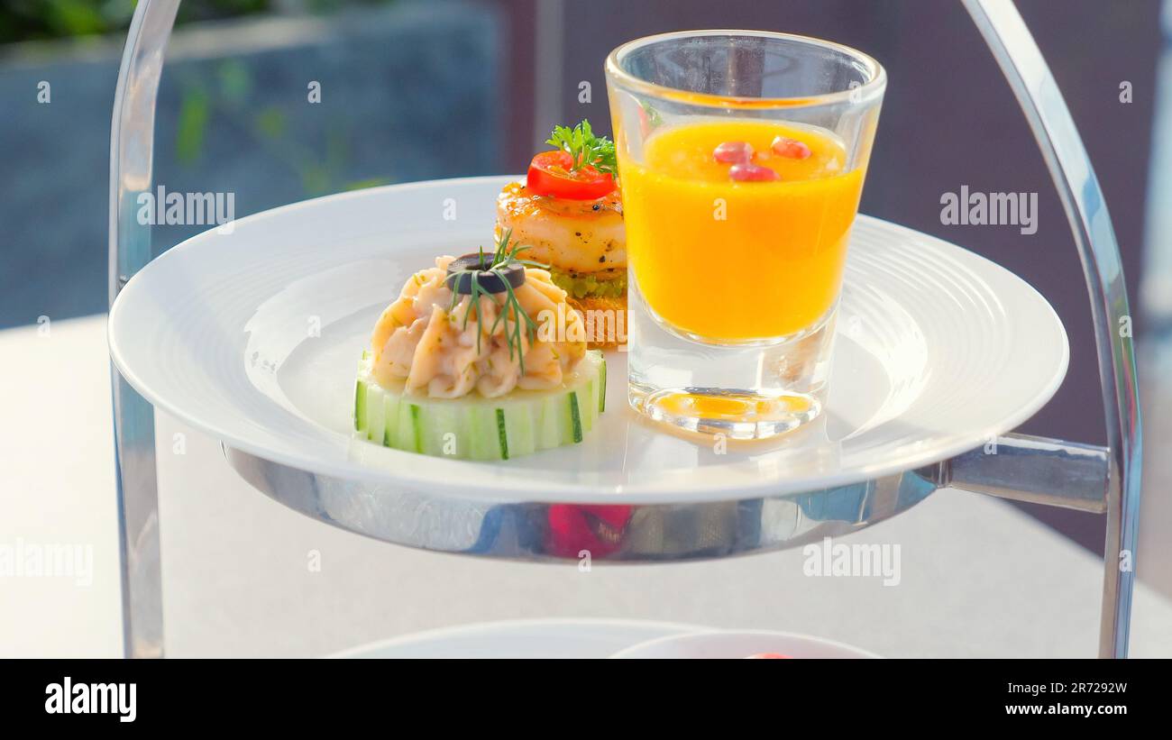 Delicious appetizers on white plate in luxury restaurant Stock Photo ...